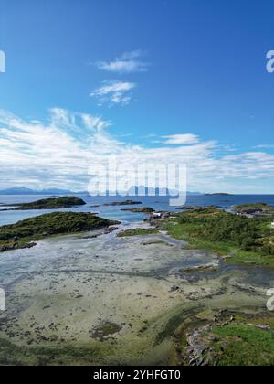 A drone vertical shot of a small road in a rural village in the ...
