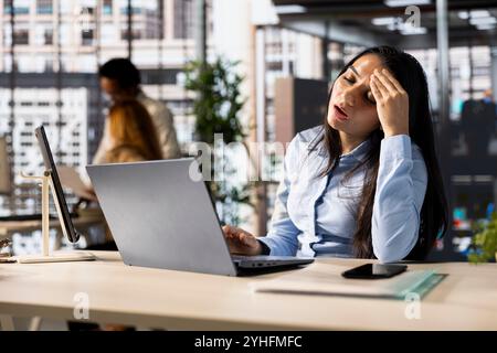 Corporate indian woman experiences business pressure at the office ...