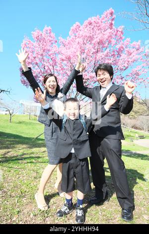First-year primary school boy and parents Stock Photo - Alamy