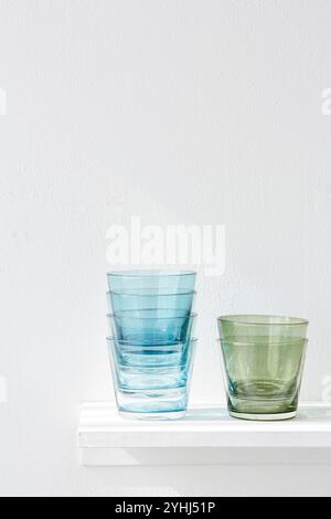 Glass cups on light blue background. Cupping therapy Stock Photo - Alamy