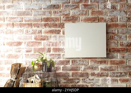 Frames and sundry objects on brick wall Stock Photo - Alamy