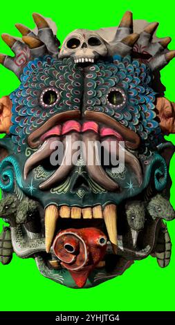 painted tiki mask with green background Stock Photo - Alamy