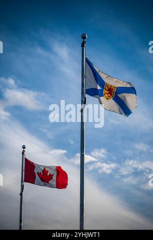 Flags of Canada and Nova Scotia flying outside a building in Halifax ...
