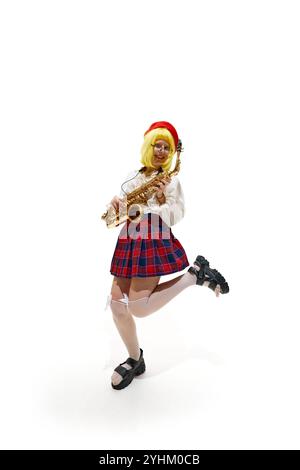 Woman with yellow wig and red beret, wearing plaid skirt, posing with ...