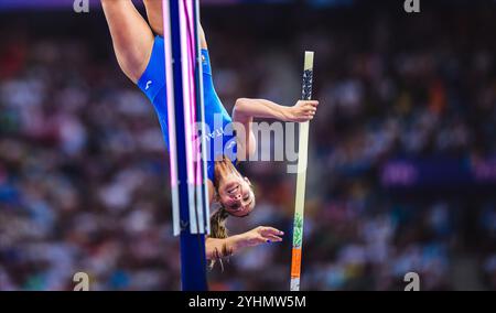Elisa Molinarolo participating in the pole vault at the Paris 2024 ...