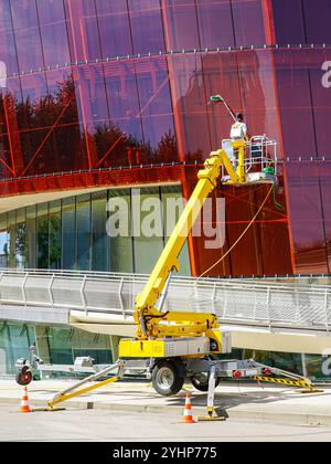 Glass facade cleaning works of a modern building using a modern ...