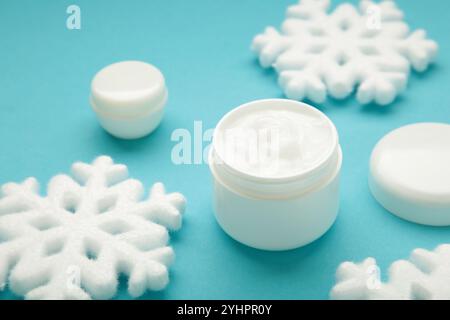 Cold protecting winter cream concept. Simple tubes and jar cosmetics ...