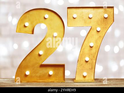 Big plastic numbers with shining light bulbs Stock Photo - Alamy