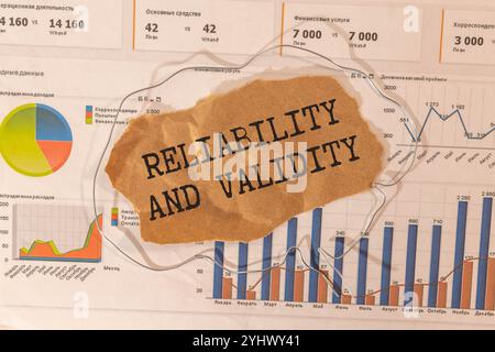 A sign with the inscription Reliability and Validity on the table with ...