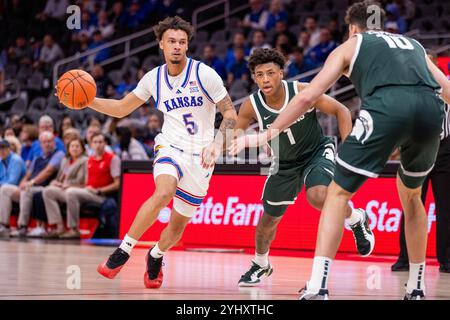 Kansas guard Zeke Mayo (5) drives around Texas Tech forward JT Toppin ...