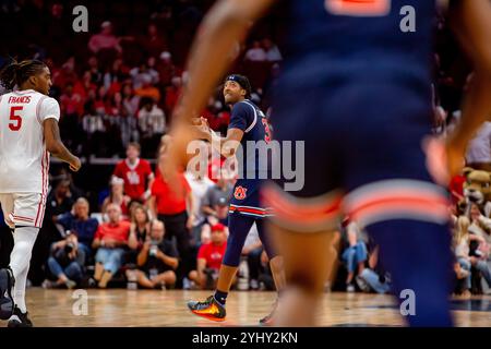 Auburn forward Chaney Johnson (31) puts up a shot over Arkansas forward ...