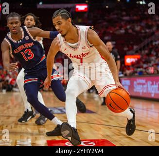 Houston guard Milos Uzan (7) drives to the basket as Colorado forwards ...