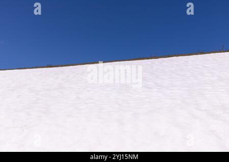 The slope has smooth snow and blue skies Stock Photo - Alamy