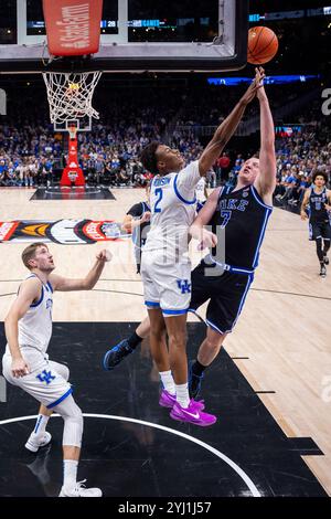 Duke guard Kon Knueppel (7) defends the ball from Virginia forward ...
