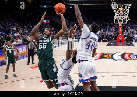 Kansas forward Flory Bidunga (40) shoots against Cincinnati forward ...