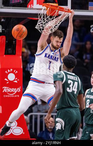 Kansas center Hunter Dickinson dunks the ball during the first half of ...