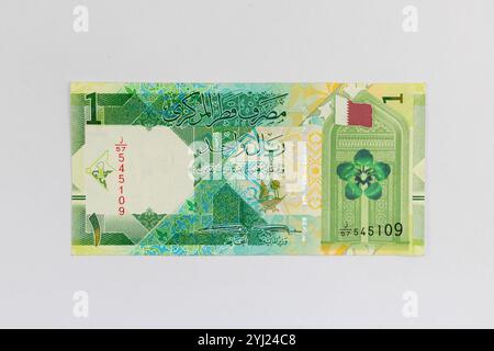 Flag of Qatar, Dreama flower and a gate representing historical Qatari ...