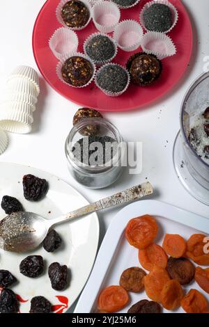 Dried fruit sweets. Balls of prunes, dates and coconut. With a sprinkle ...