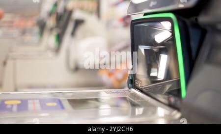 Customer scans food products at selfservice kiosk in store Stock Photo ...