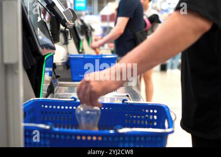Customer scans food products at selfservice kiosk in store Stock Photo ...