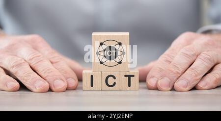 Wooden blocks with symbol of ict concept Stock Photo - Alamy