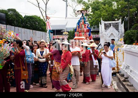Local thai people join parade attend procession ritual give offering to Buddhist monk or ...