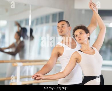 Ballet partners mastering paired technique during group class Stock ...