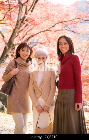 Three generations of women enjoying autumn leaf peeping Stock Photo - Alamy