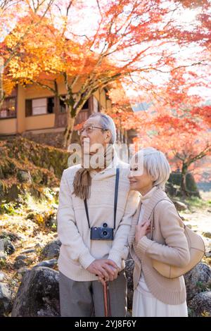 Senior couple enjoying autumn leaf peeping Stock Photo - Alamy