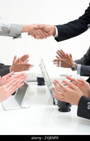 Businessperson clapping hands shaking hands Stock Photo - Alamy