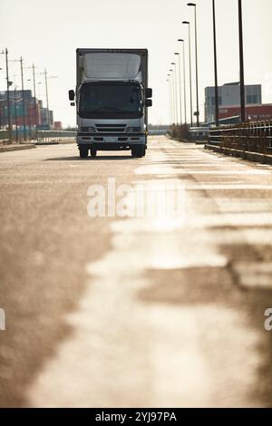 Truck running on a straight road Stock Photo - Alamy