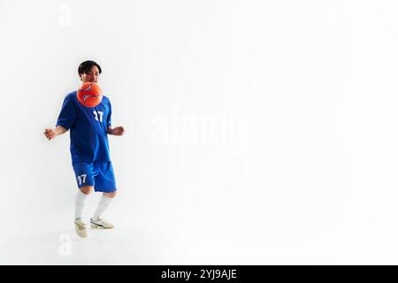 Footballer doing chest trap Stock Photo - Alamy