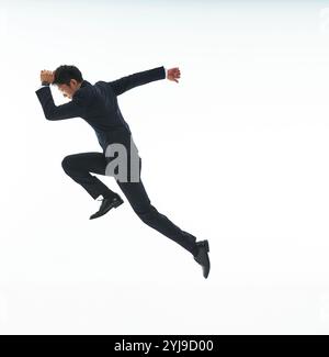 Office worker running with smartwatch Stock Photo - Alamy