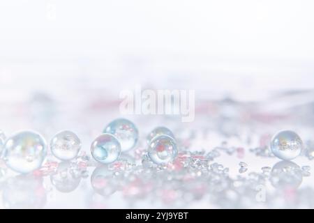 Multiple glass grains placed on a reflective plate Stock Photo - Alamy