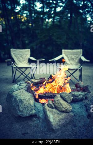 Building a bonfire at a campsite Stock Photo - Alamy