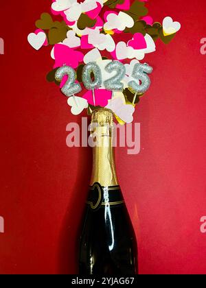 Champagne glass with beautiful golden confetti in shape of star on blue ...
