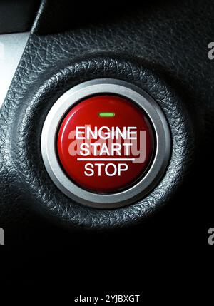Start and stop button on the cockpit of a modern car next to the gear ...