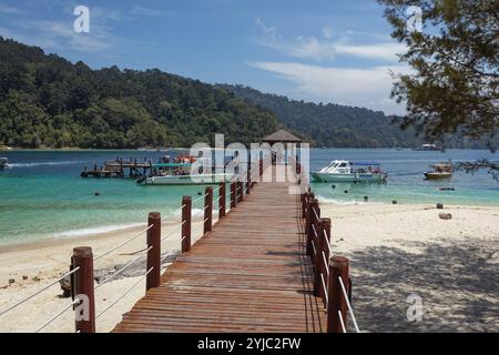 Wooden pier and boats at Sapi island KOta Kinabalu, Sabah, Malaysia ...