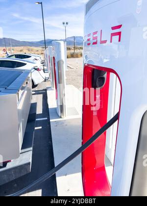 Side View of Tesla Cybertruck Charging at Supercharger Station Stock ...