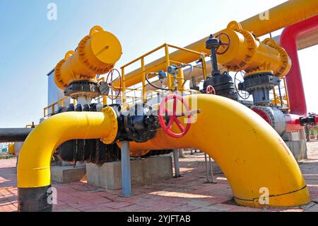 The pipe and valve oil fields Stock Photo - Alamy