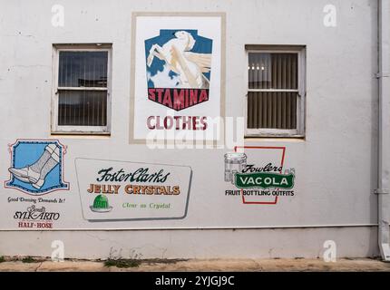 Vintage advertising signs as street murals in the small town of ...