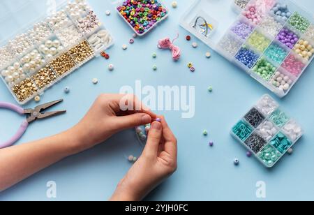 Craft workspace with colorful threads, beads, scissors, and organized ...