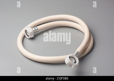 White Plastic Pipe Connectors on Wooden Background Stock Photo - Alamy