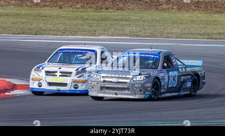 Matthew Simpson (L) and Dale Gent battle through Williams during the ...