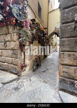 Charming narrow street in Italian city with colorful buildings and ...