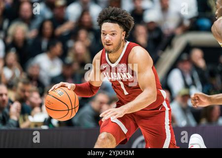 Alabama guard Mark Sears (1) dribbles past Georgia guard Dakota Leffew ...