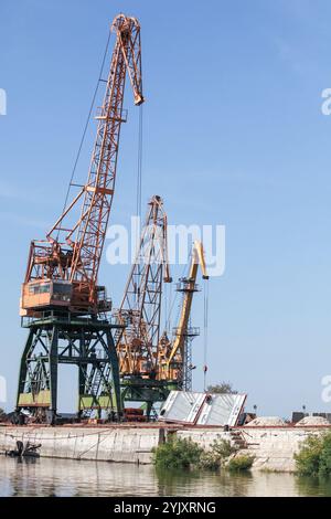 Ruse port, coastal view with portal cranes standing at the quay and a ...