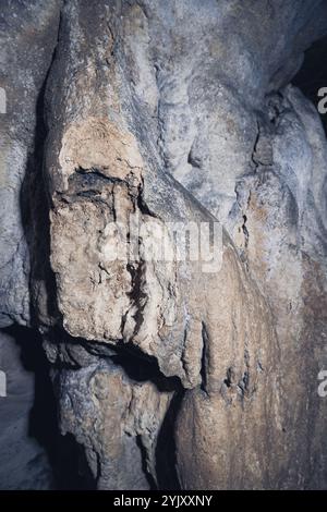 A stone in the Bukit Buntu Kesu Tana Toraja cave is shaped like a large ...