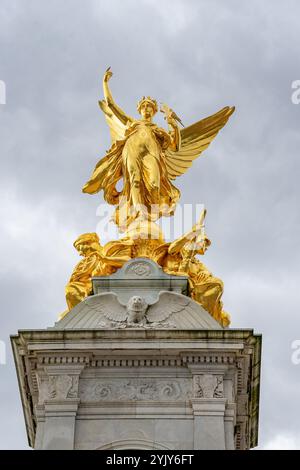 flag of england and angel of justice in london Stock Photo - Alamy