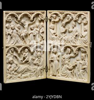 A 14th century French ivory diptych with traces of polychromy and metal ...